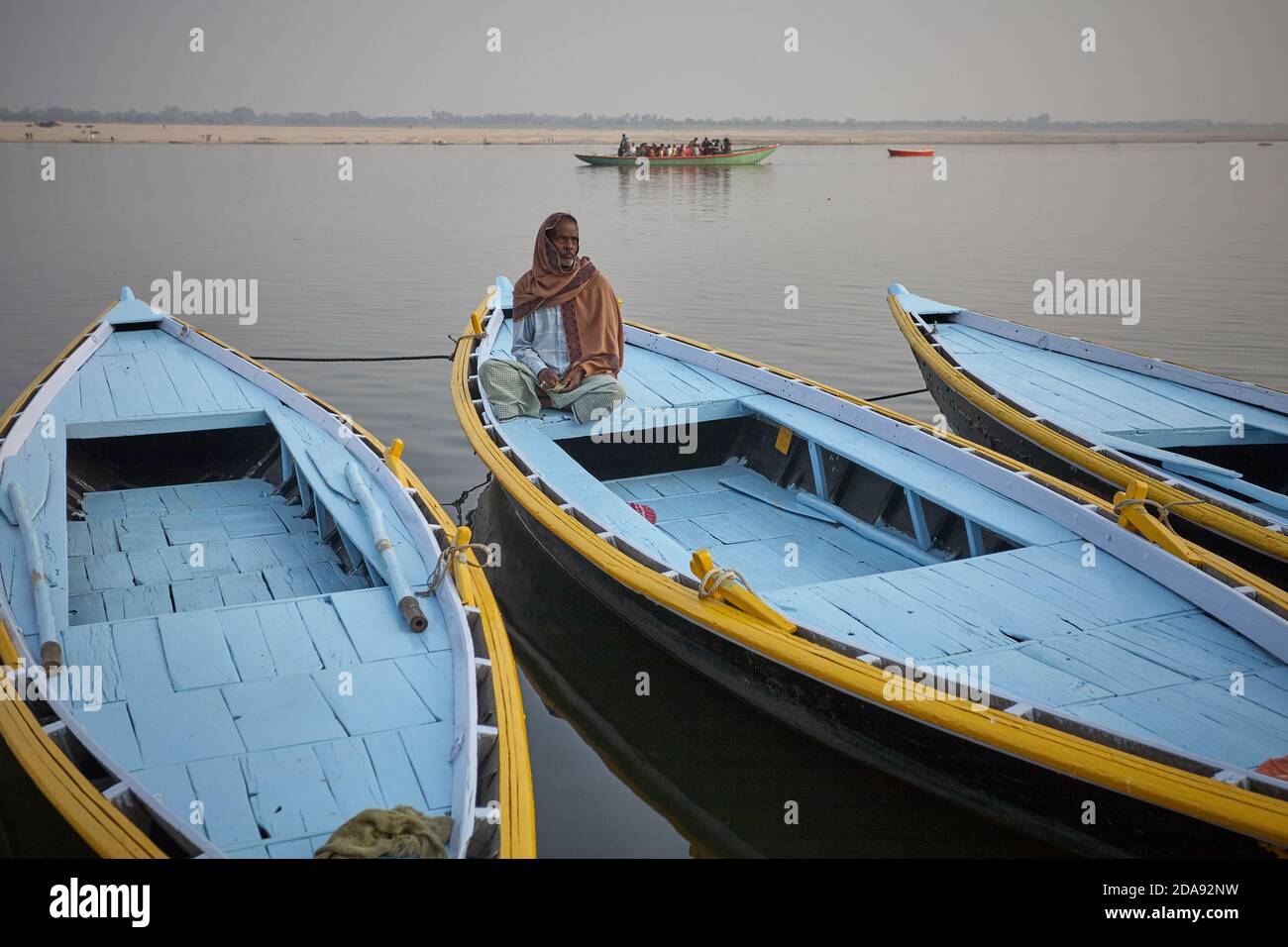 Indian man sitting on boat varanasi hi-res stock photography and images ...