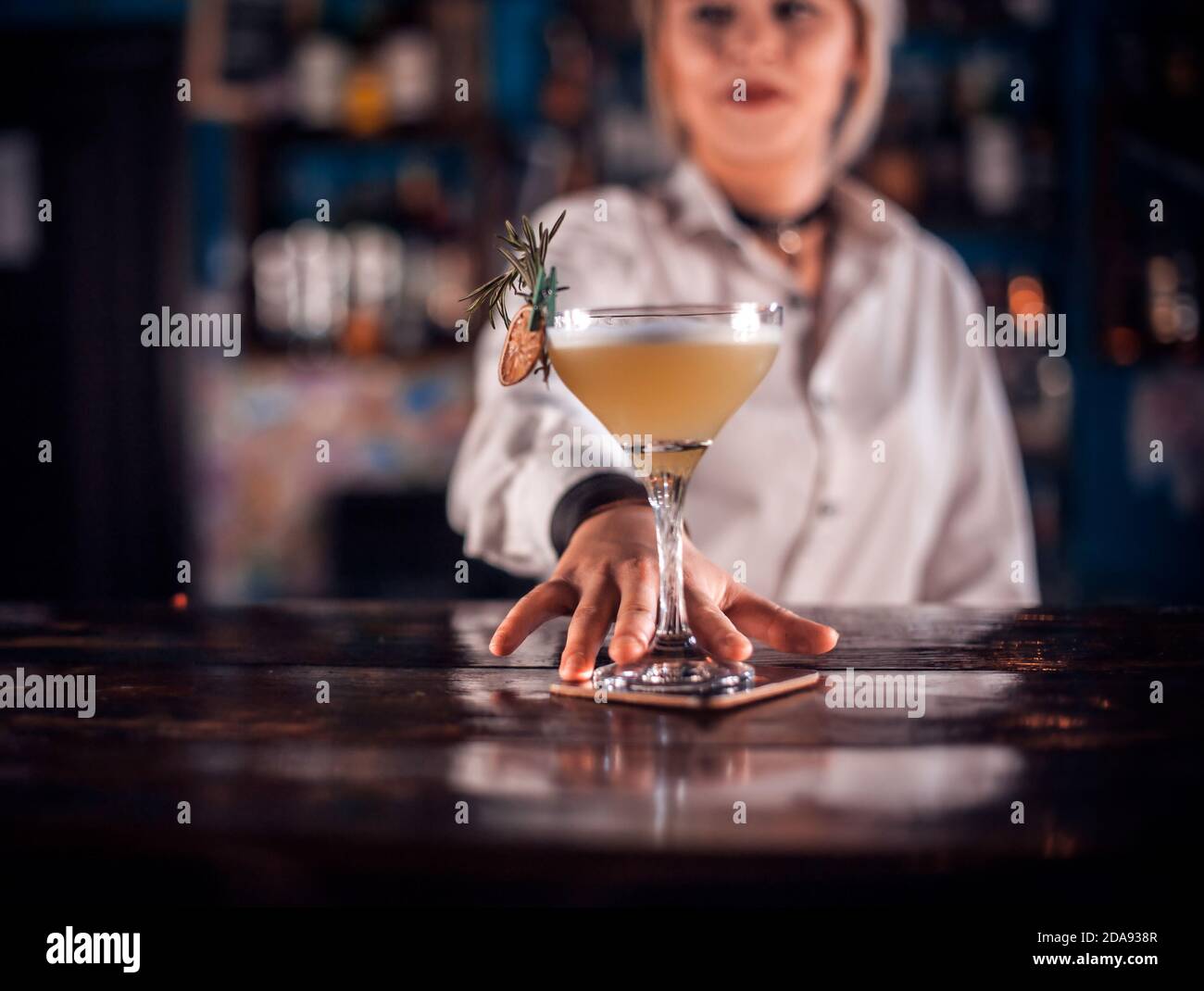 Young barmaid demonstrates his professional skills on the bar Stock ...