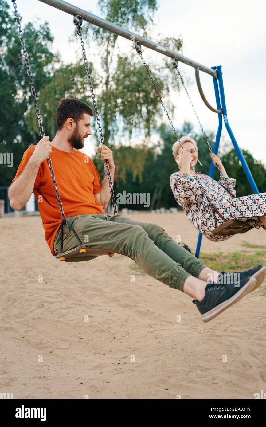 Romantic couple is having fun outside. Enjoying spending time together ...