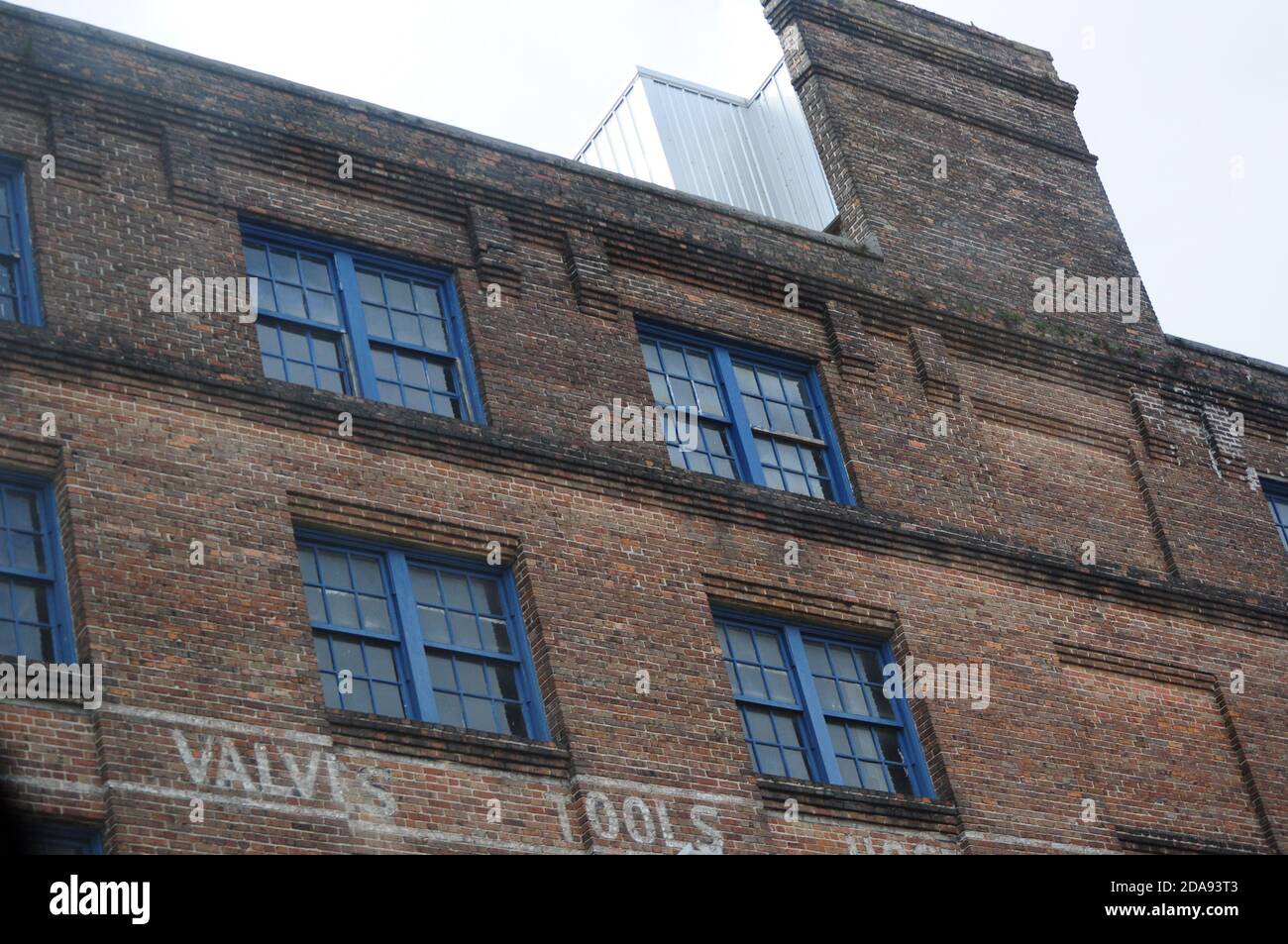 An industrial rustic looking building. Brick with old-school windows ...