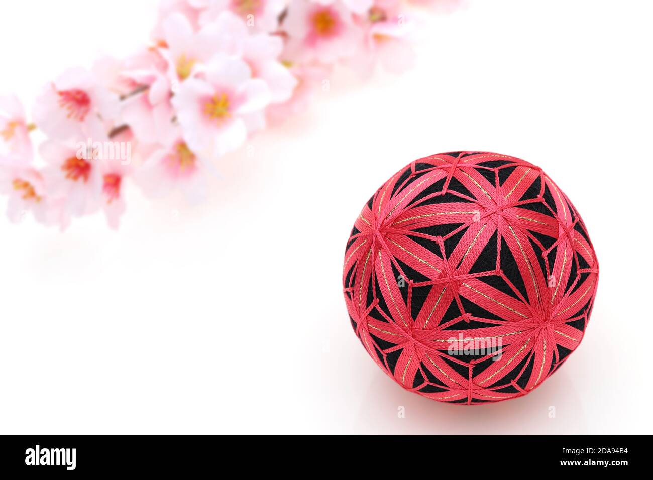 Japanese traditional temari ball with cherry blossoms on white ...