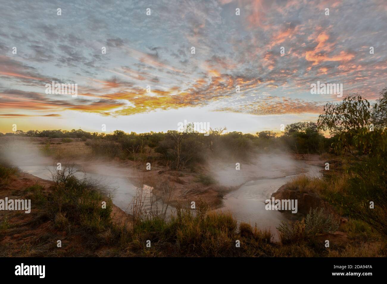 Ethereal view of team rising from a thermal bore at sunrise in the ...