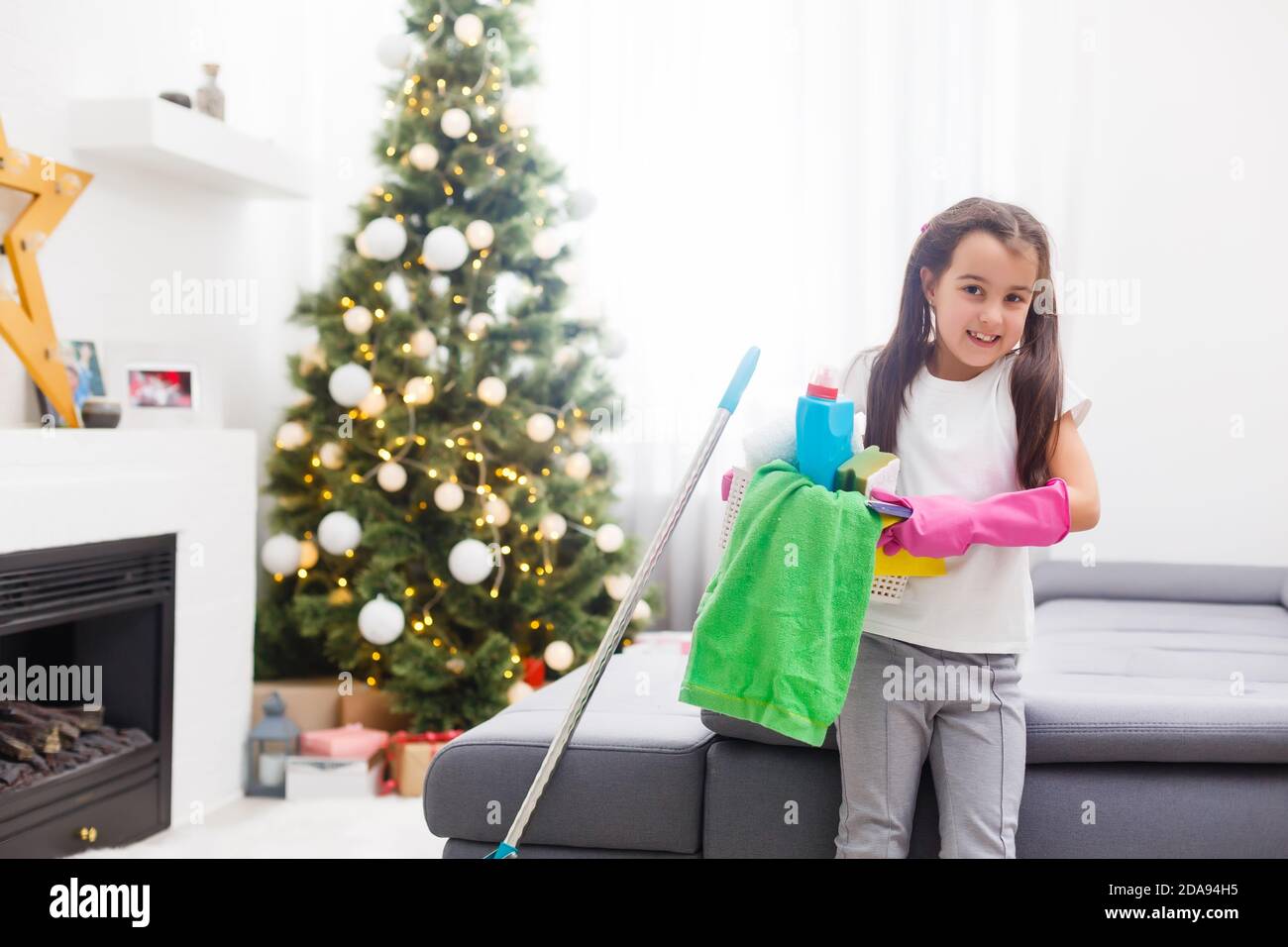 Little housekeeping fairy girl doing home chores Stock Photo - Alamy
