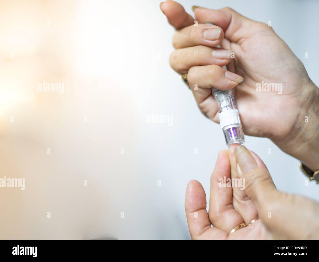 The diabetic patient hand using the self injection medical equipment ...