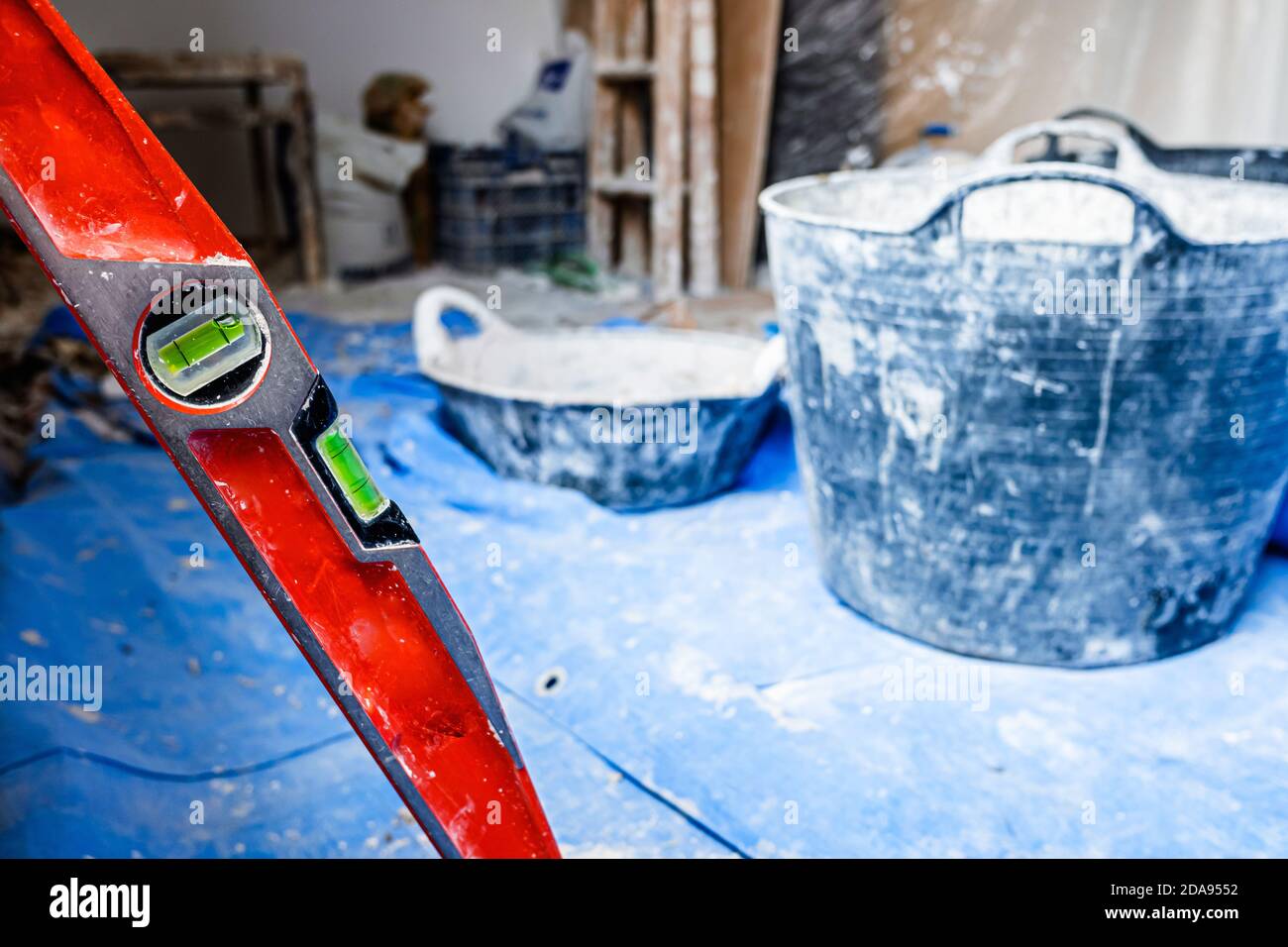 Level and other masonry tools in a renovation work Stock Photo - Alamy