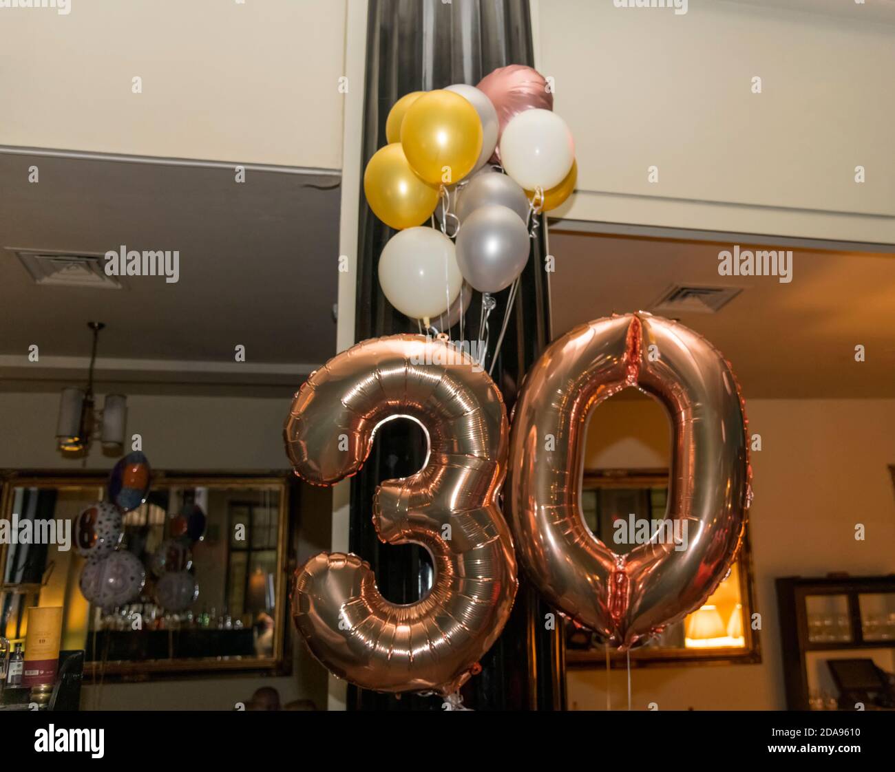 Golden number 30 thirty made of inflatable balloons Stock Photo - Alamy