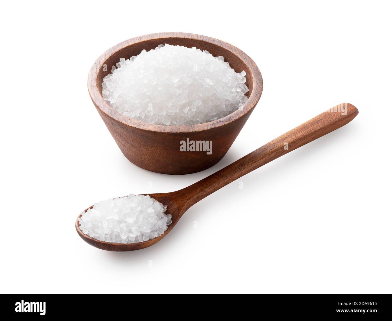 A wooden spoon and a bowl of Himalayan rock salt on a white background ...