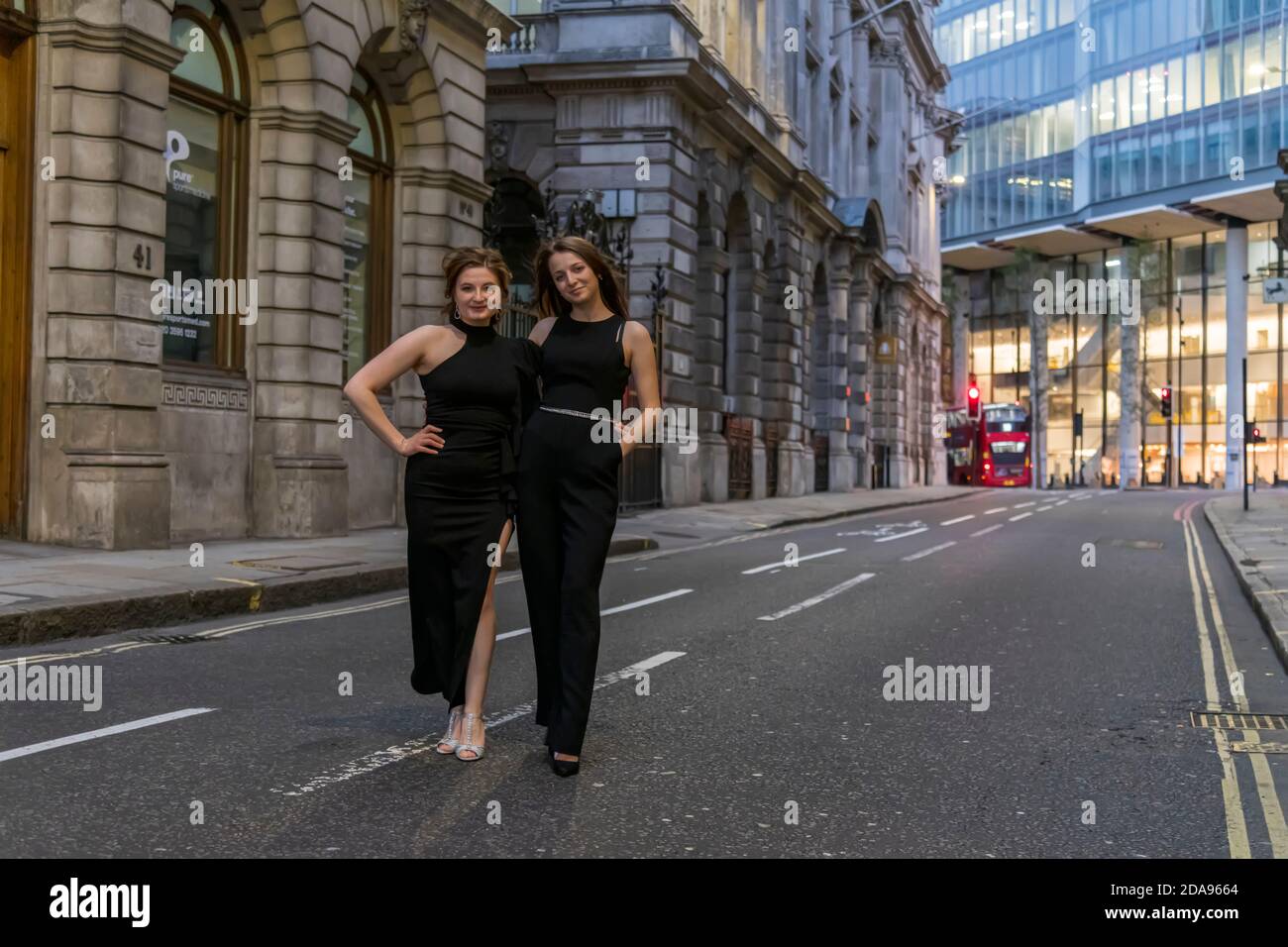 Two young cheerful friends having fun together posing for camera, City ...