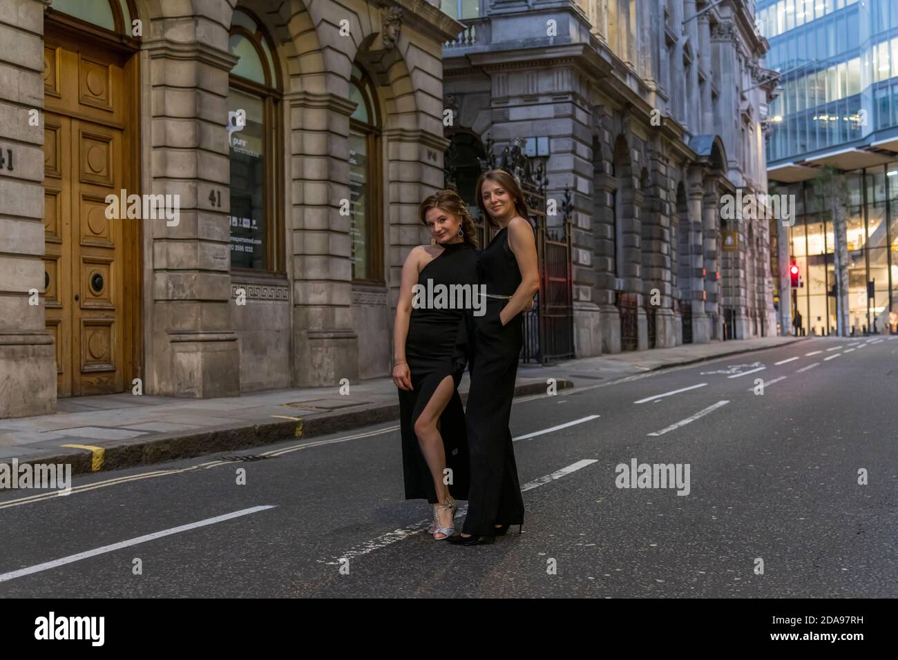 Two young cheerful friends having fun together posing for camera, City ...