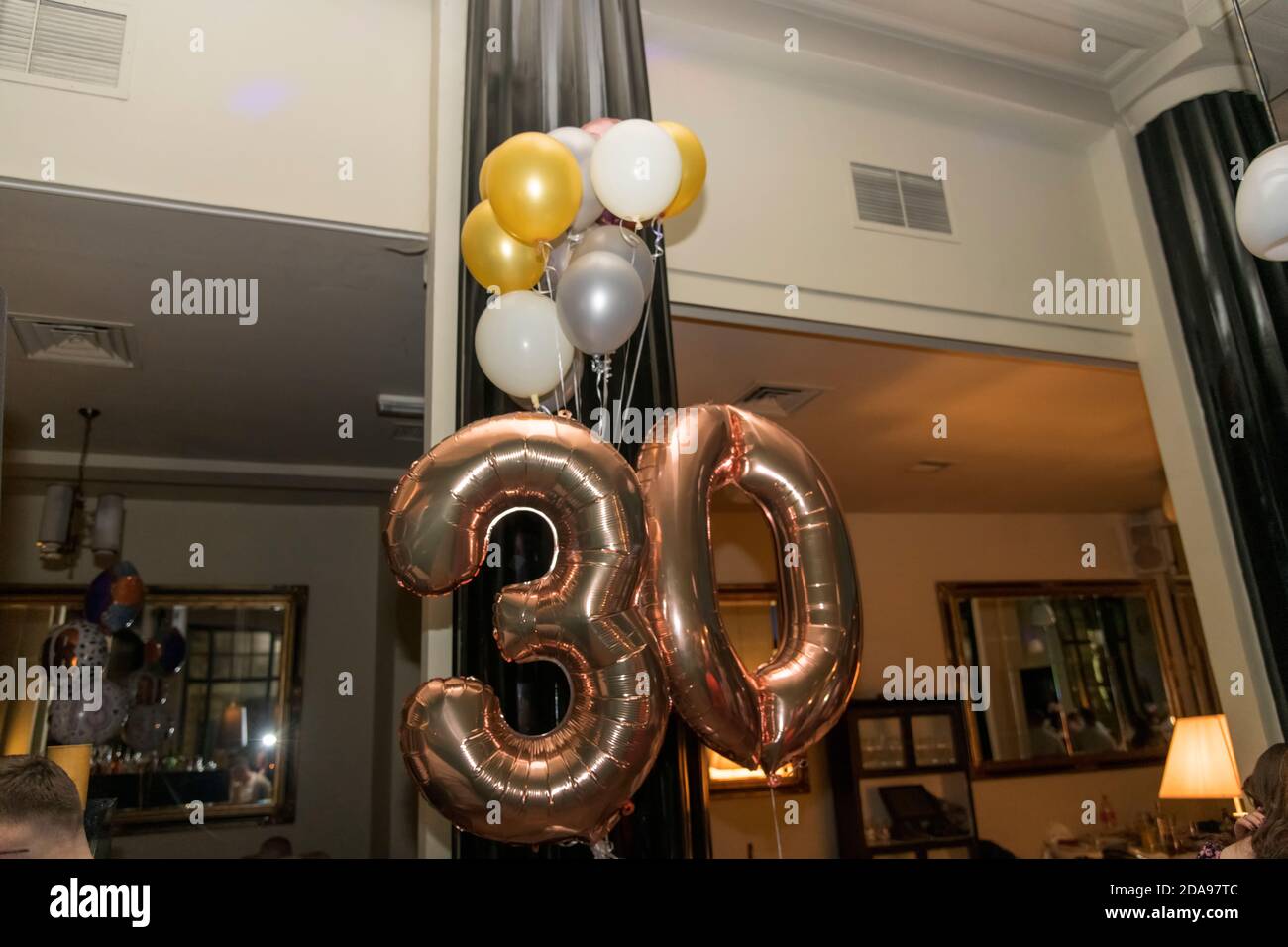Golden number 30 thirty made of inflatable balloons Stock Photo - Alamy