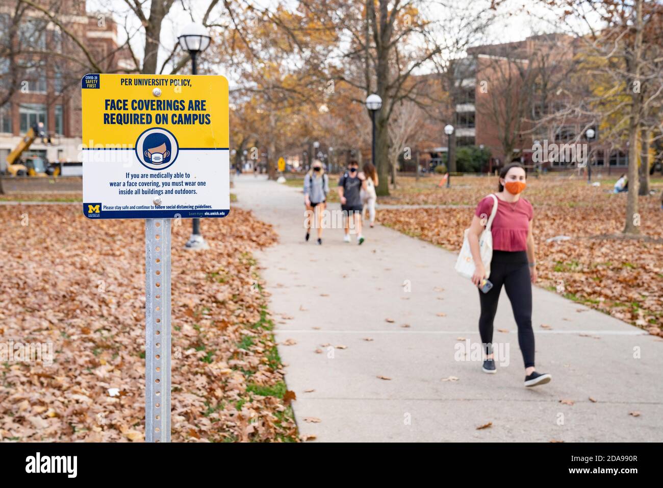Ann Arbor, Michigan, USA. 10th Nov, 2020. People wearing masks walk by ...