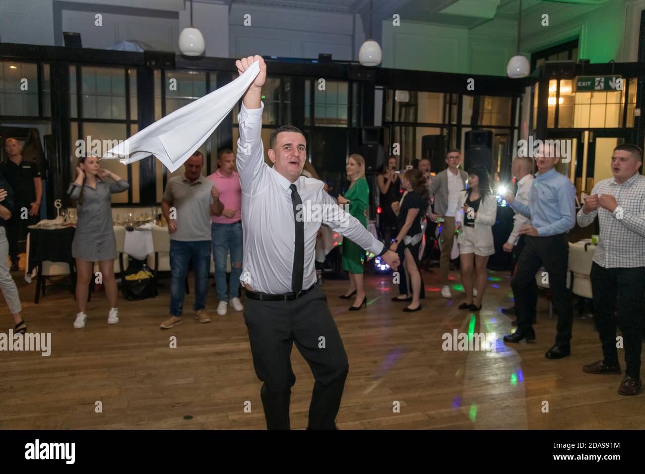 Portrait of young beautiful man dancing with restaurant in the ...