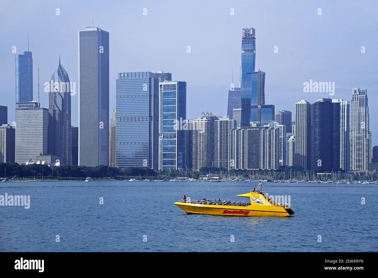 A Seadog speedboat cruising on Lake Michigan with the Chicago skyline ...