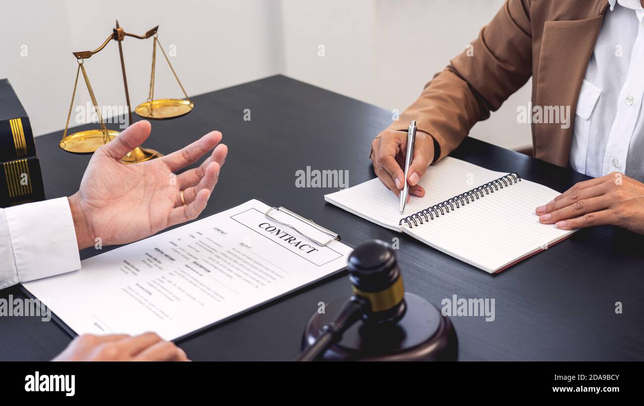 lawyer or judge meeting with client consulting help discussing contract ...
