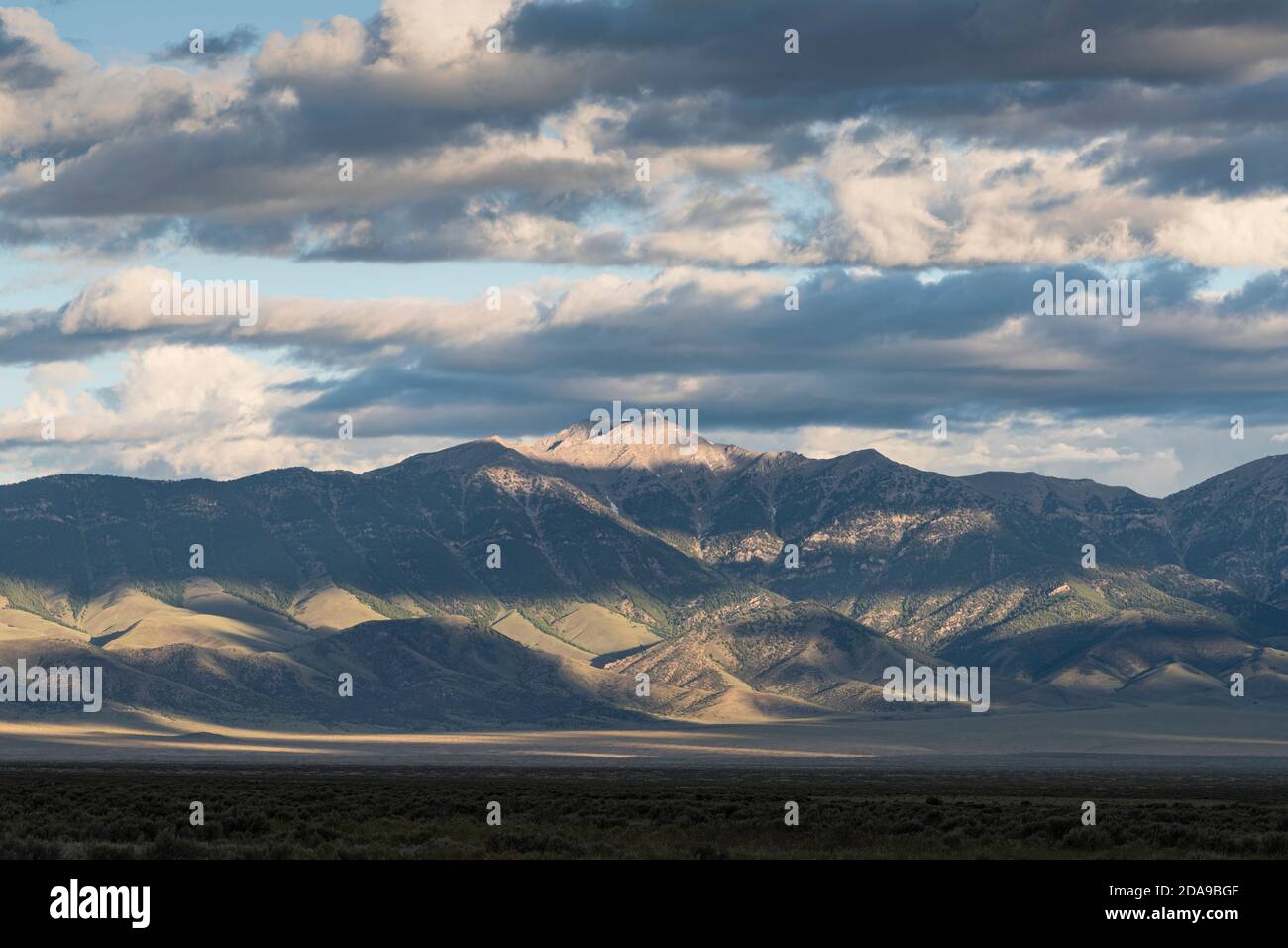 Sunlight streaks across Saddle Mountain in the Lemhi Range, Idaho Stock ...