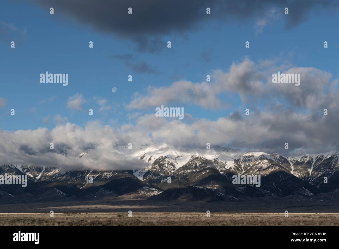 The moon sets over the southern end of Idaho's Lemhi Range as clouds ...