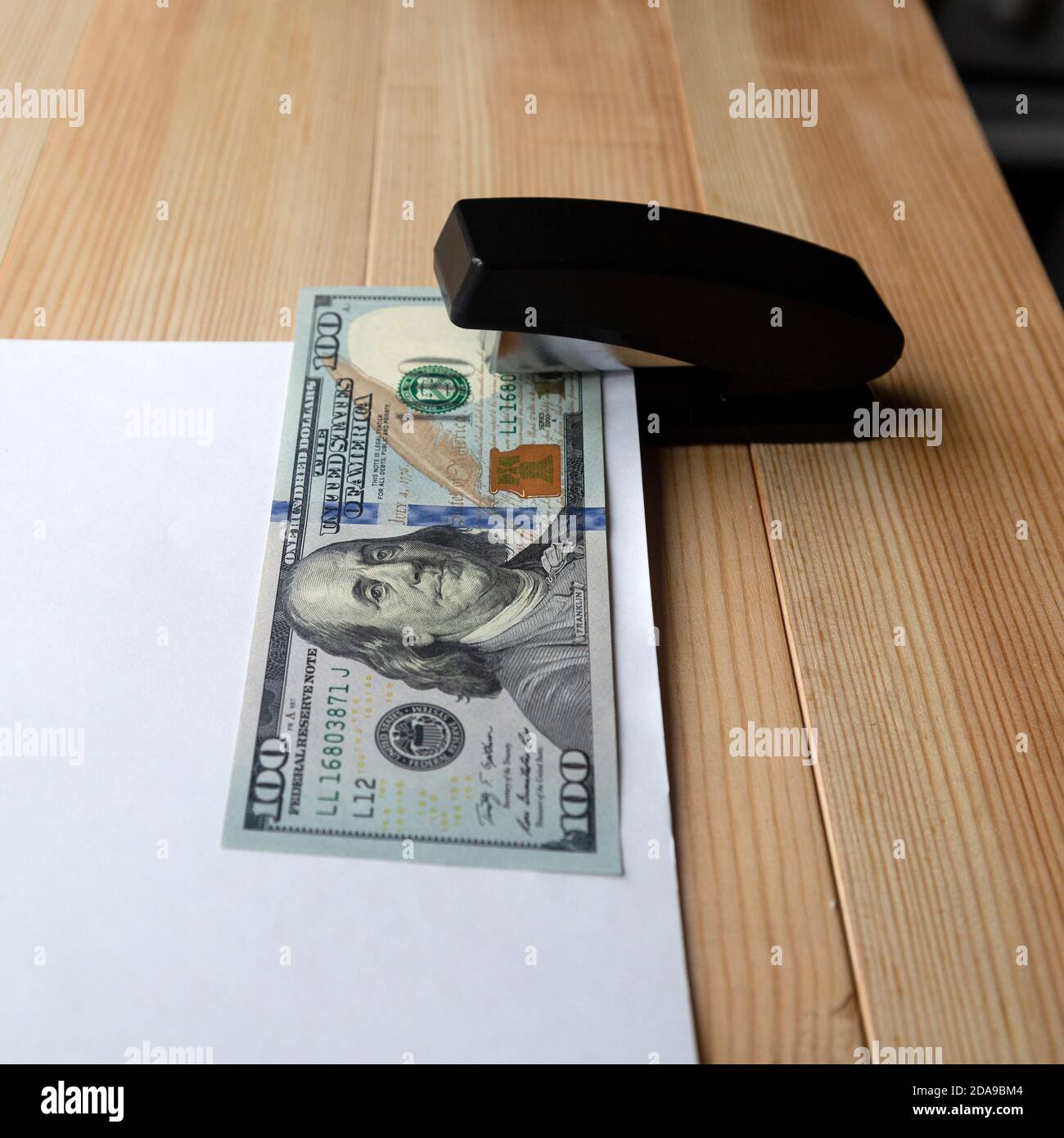 The paper money is pinned the document. Concept Stock Photo - Alamy