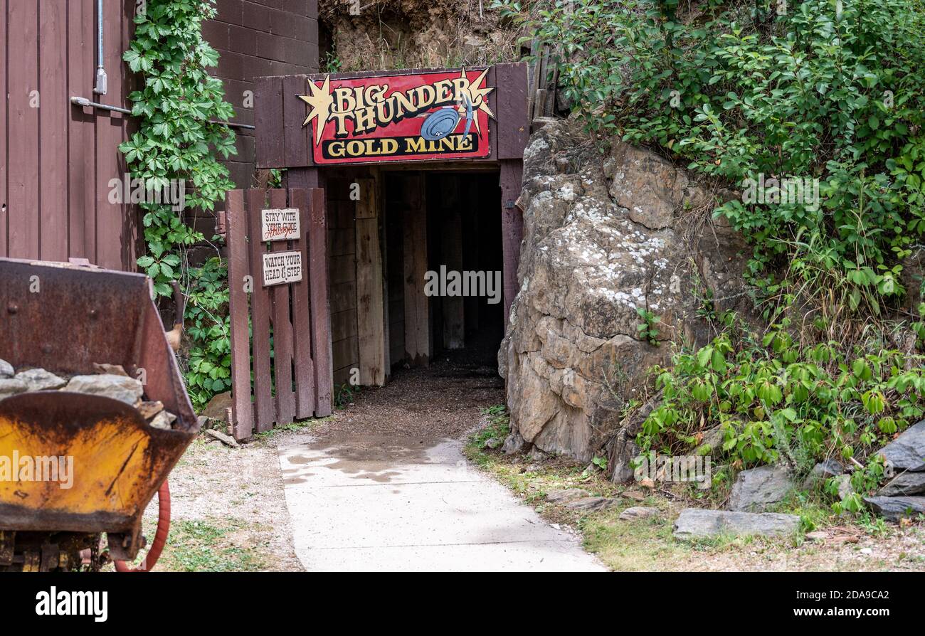 Entrance sign to a tourist attraction - historic gold mine Stock Photo ...