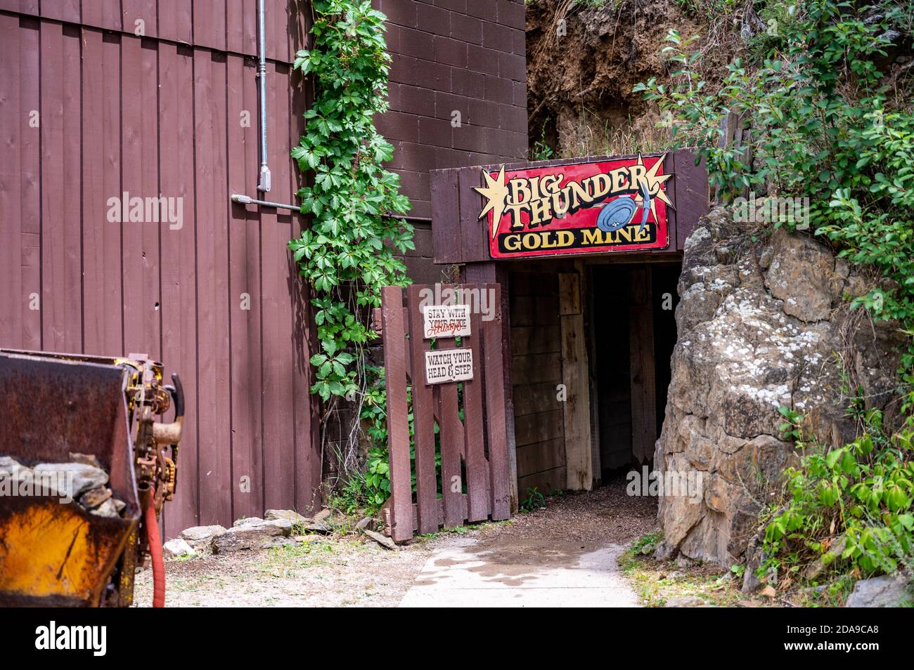 Entrance sign to a tourist attraction - historic gold mine Stock Photo ...