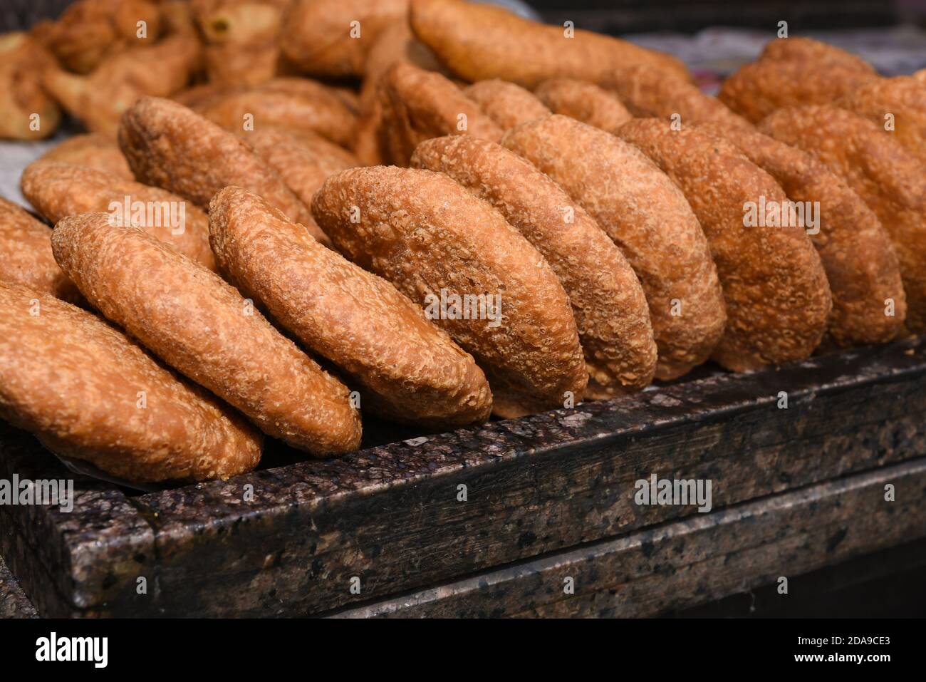 Top view of hot and spicy onion or Pyaaz Kachori and Rajasthani Mirchi ...