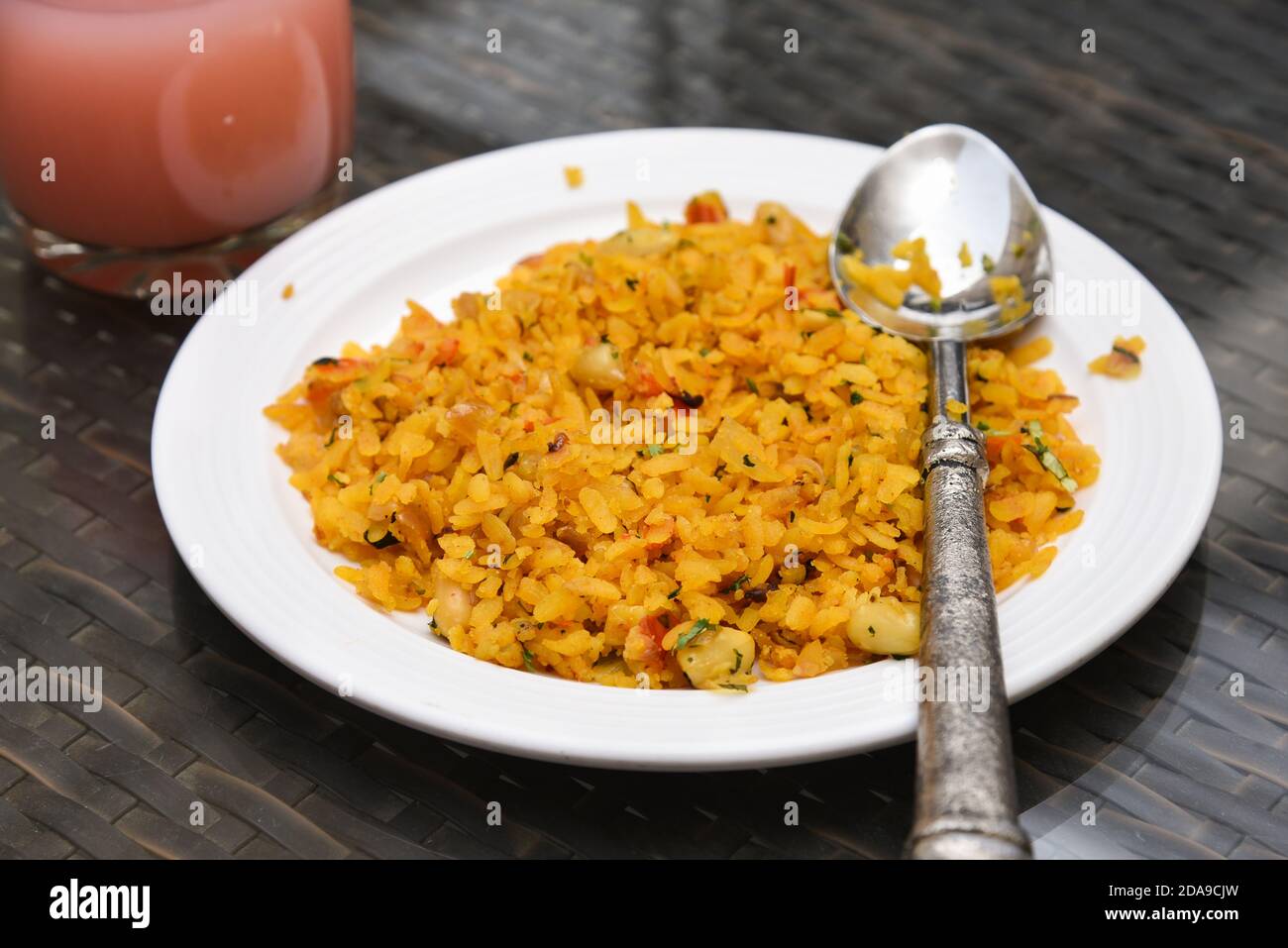 Poha or onion pohe with pickle spicy popular traditional Indian ...