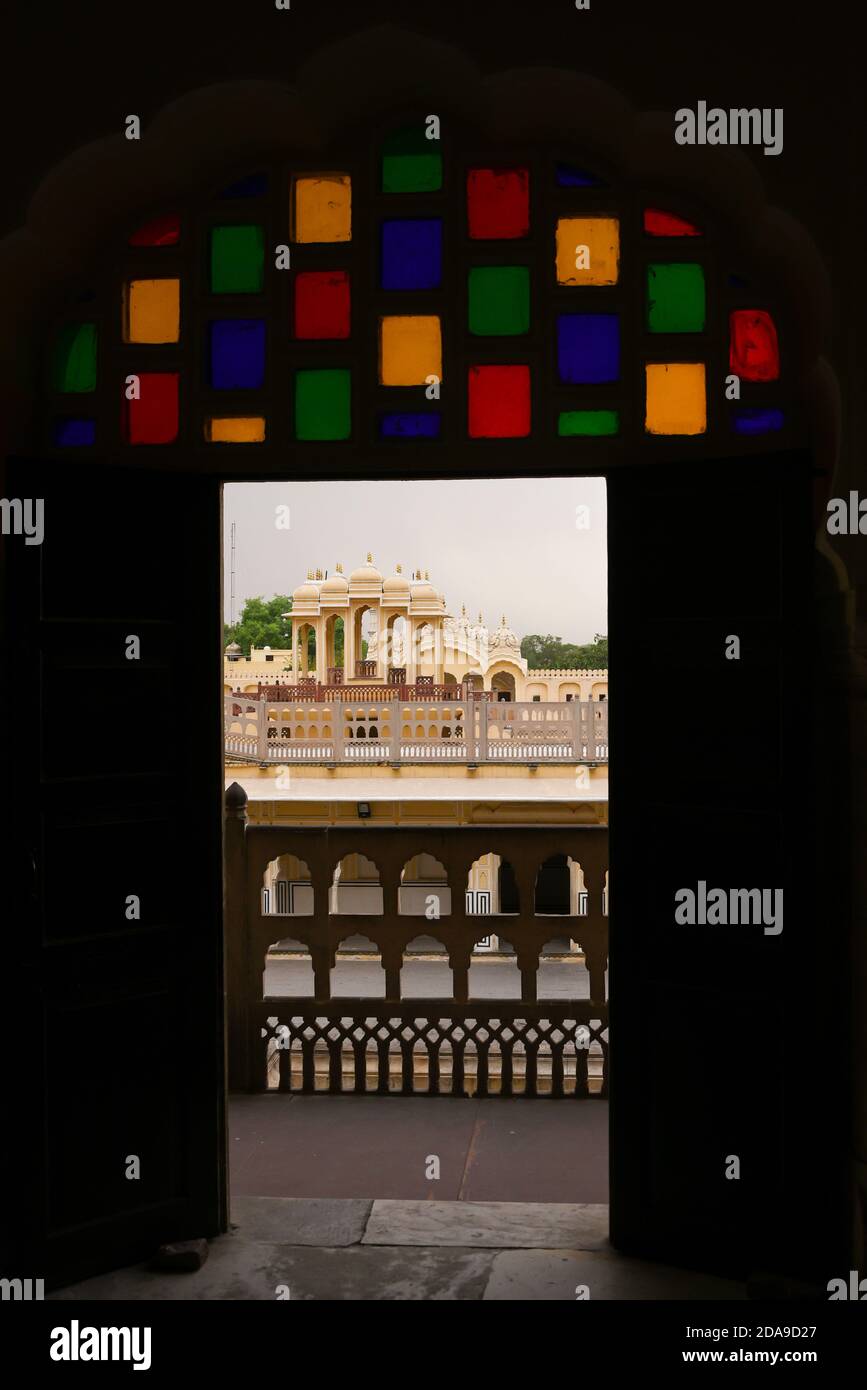 Woman tourist at Hawa Mahal windows or Rahasthan Palace of winds or ...