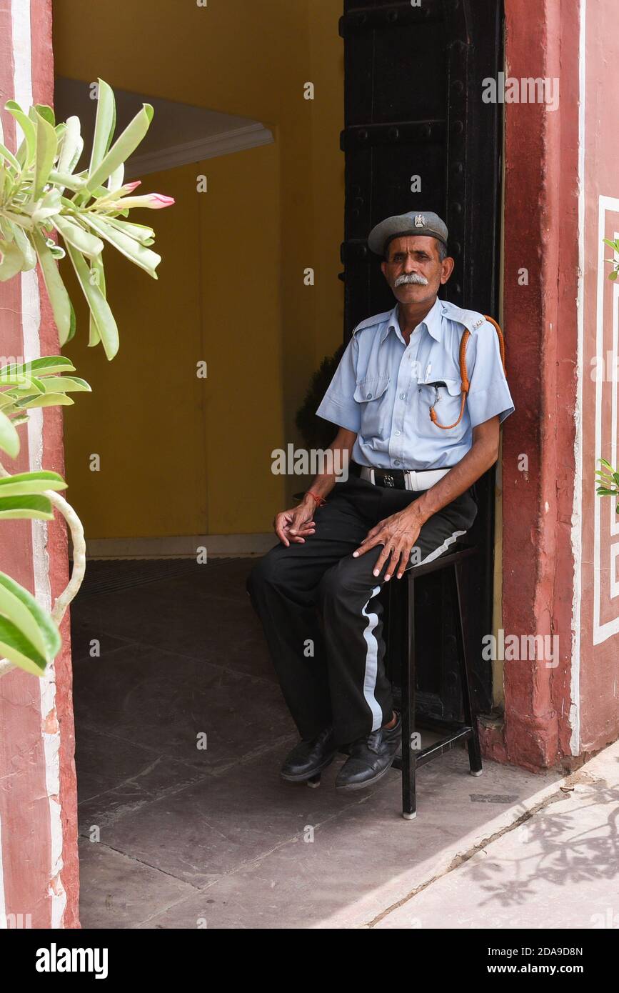 Indian Man wearing security guard uniform at the entrance gate of City ...