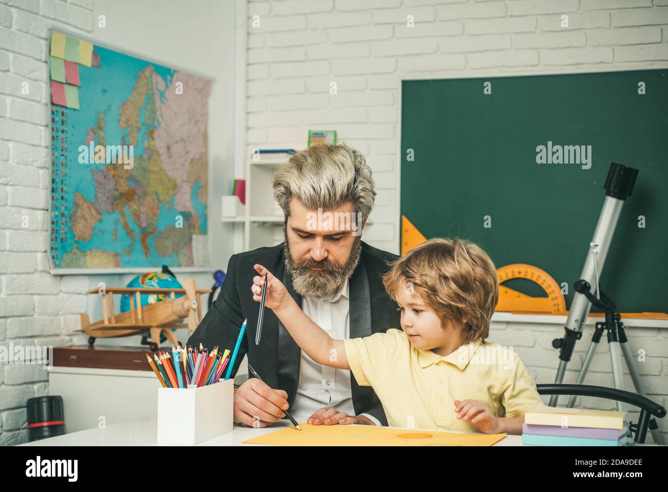 School community partnership models. Cute pupil and his father ...