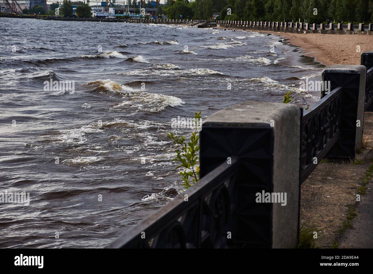 Along the sandy shore of the lake, there is a granite embankment, which ...