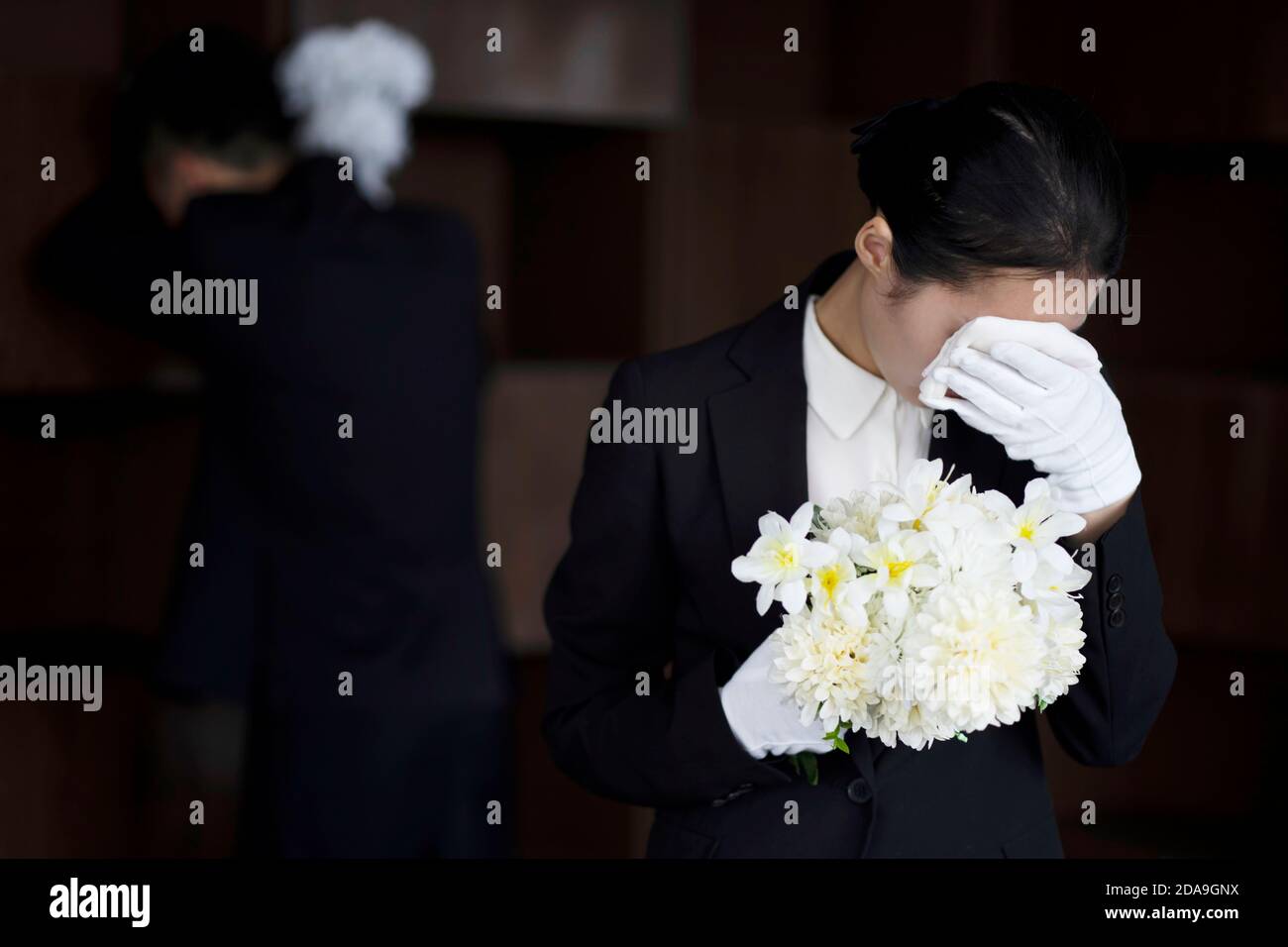 Crying grieving funeral hi-res stock photography and images - Alamy