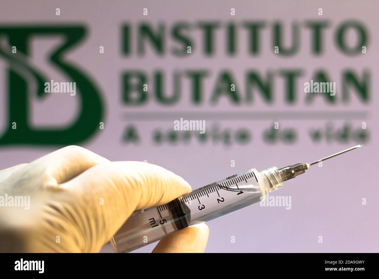 In this photo illustration a medical syringe seen with an Instituto ...
