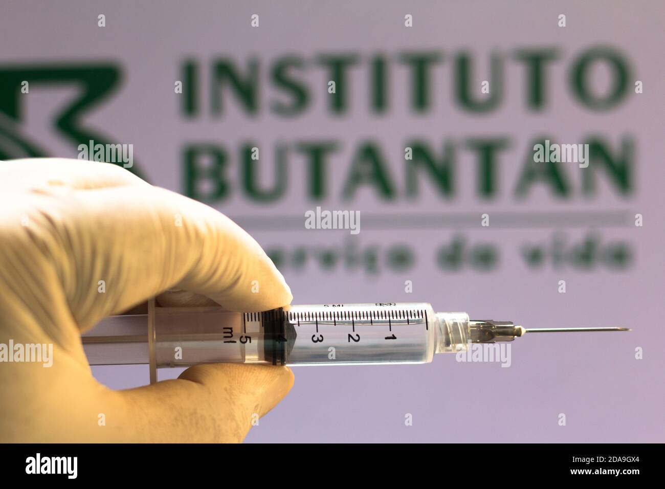 In this photo illustration a medical syringe seen with an Instituto ...
