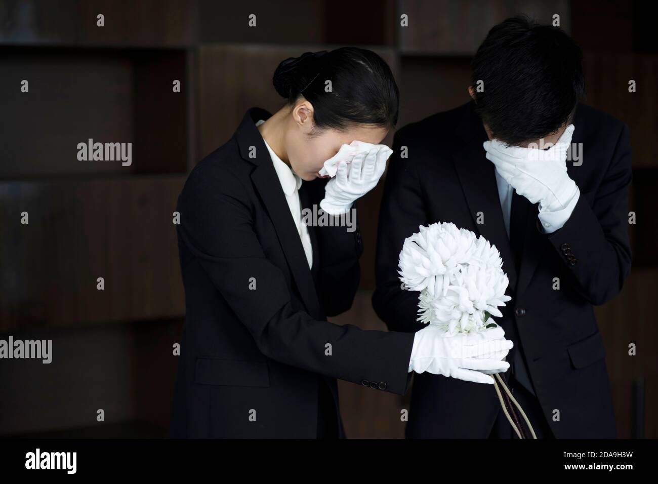 Sadness bereaved crying at funeral Stock Photo - Alamy