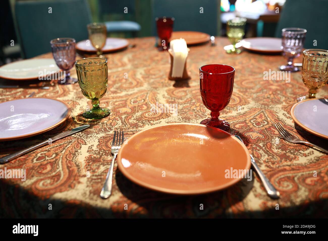 Plate set on dining table in restaurant Stock Photo - Alamy