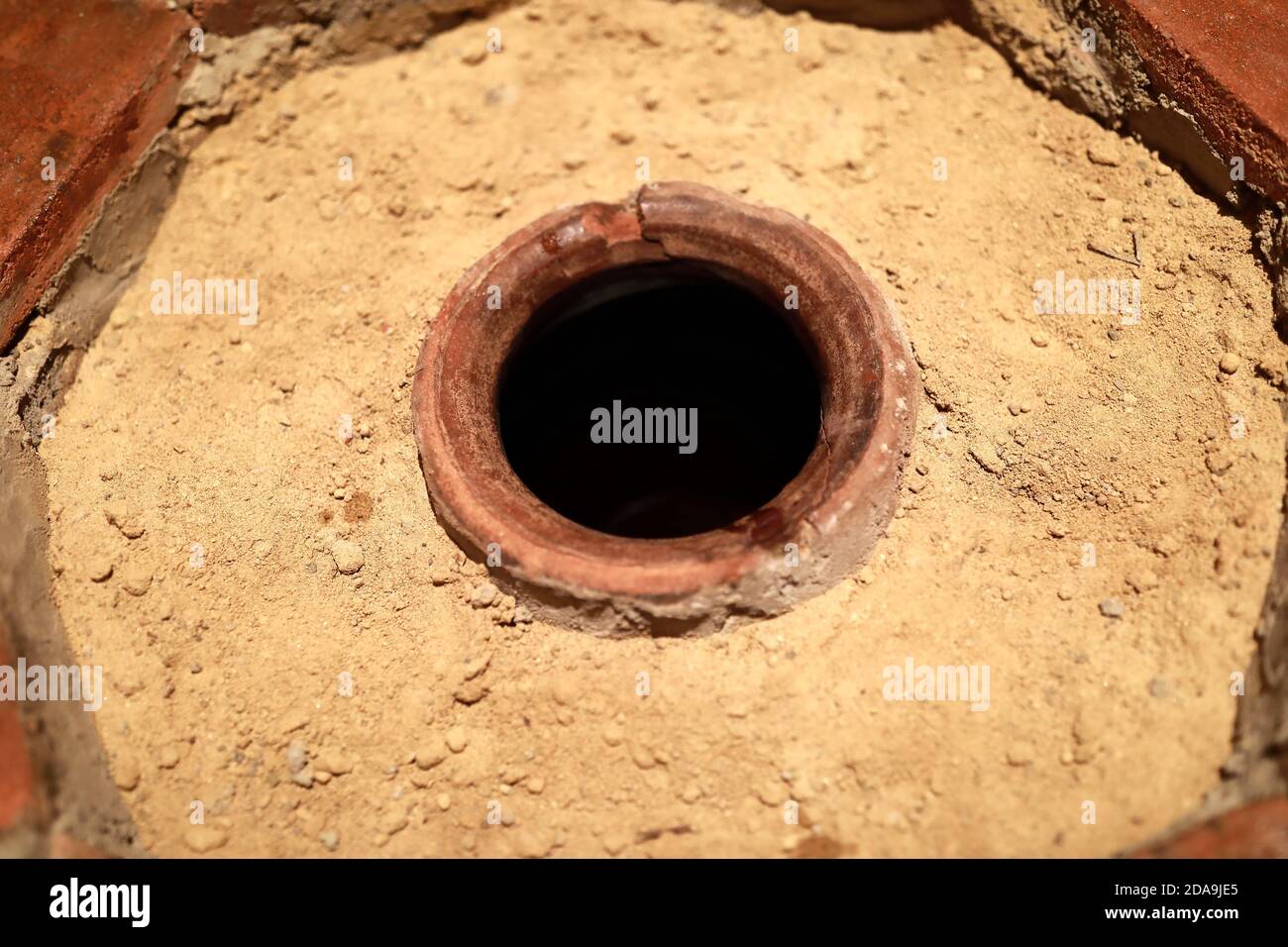 Open georgian kvevri in the basement, Georgia Stock Photo - Alamy