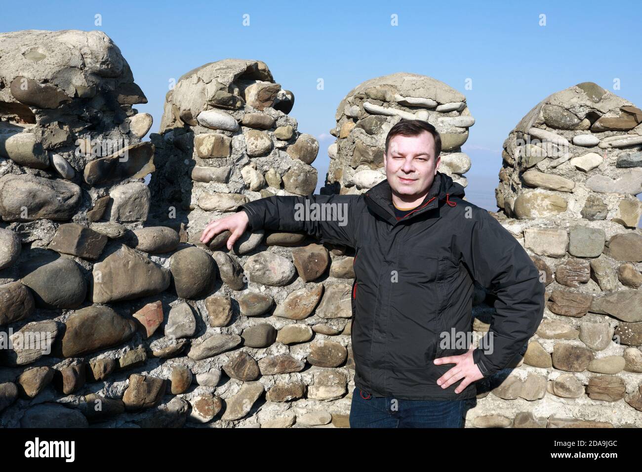 Man on background of Fortress wall in Signagi town, Georgia Stock Photo ...