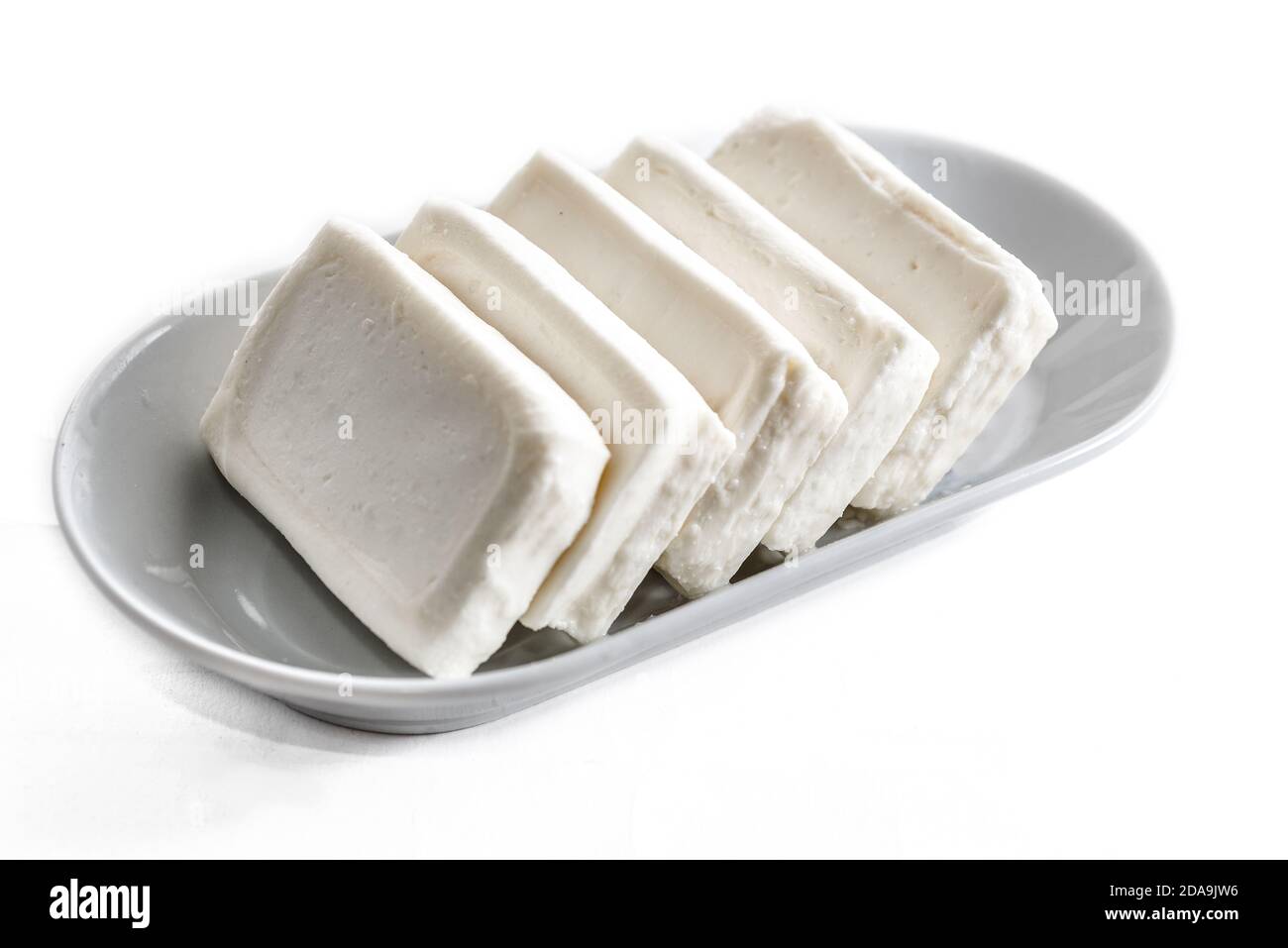 Nabulsi arabic cheese on white plate on a white background Stock Photo ...
