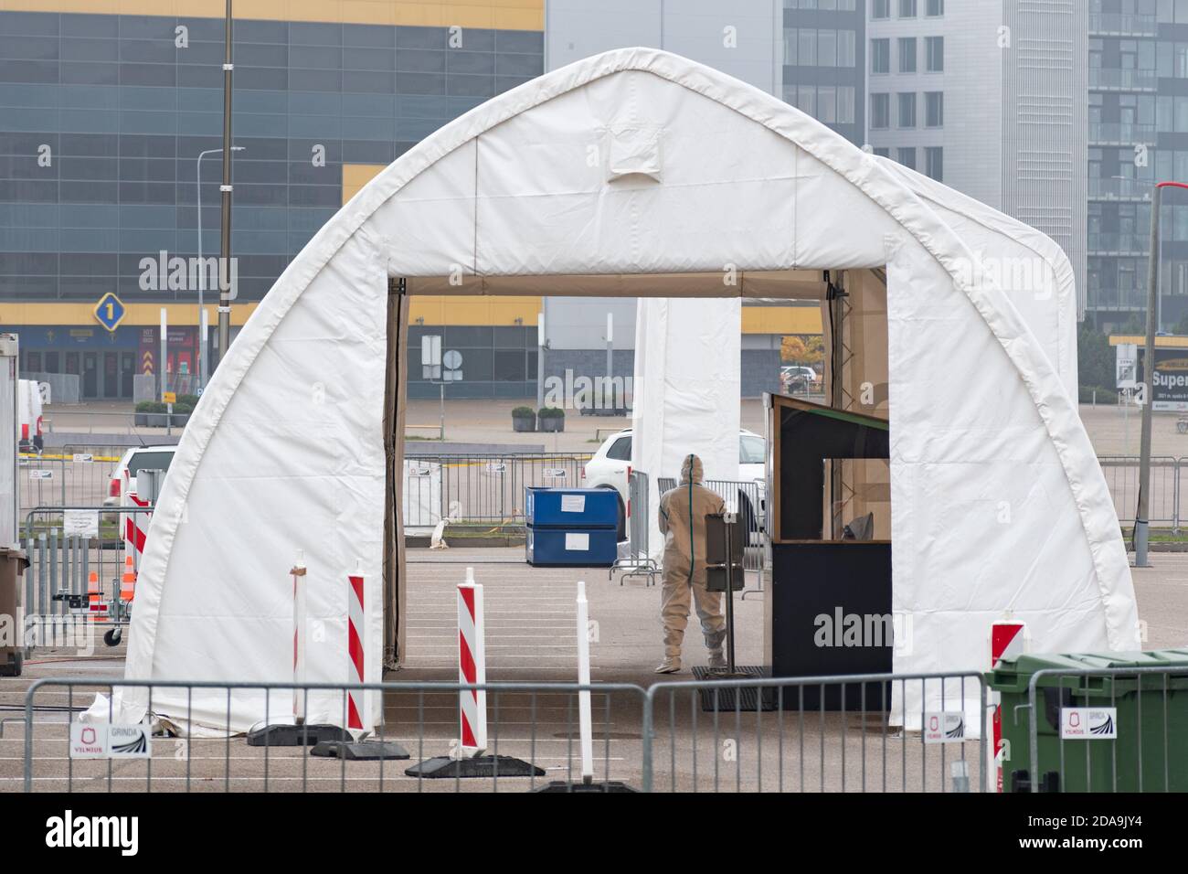 Many mobile testing station white tents in a row, hot spot for swab ...