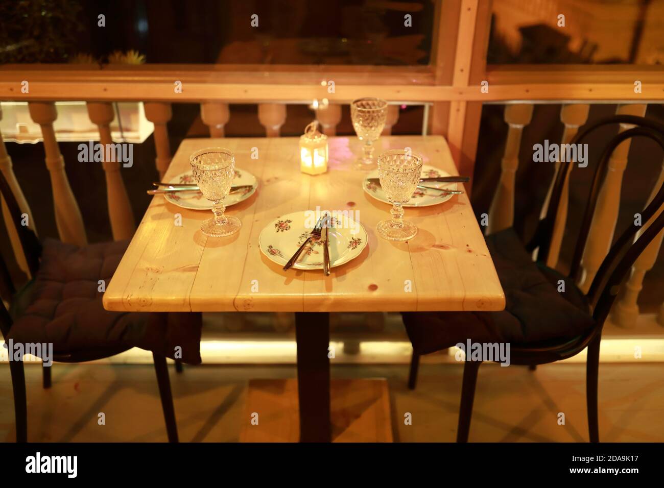 Restaurant terrace wooden table at night, Tbilisi Stock Photo - Alamy