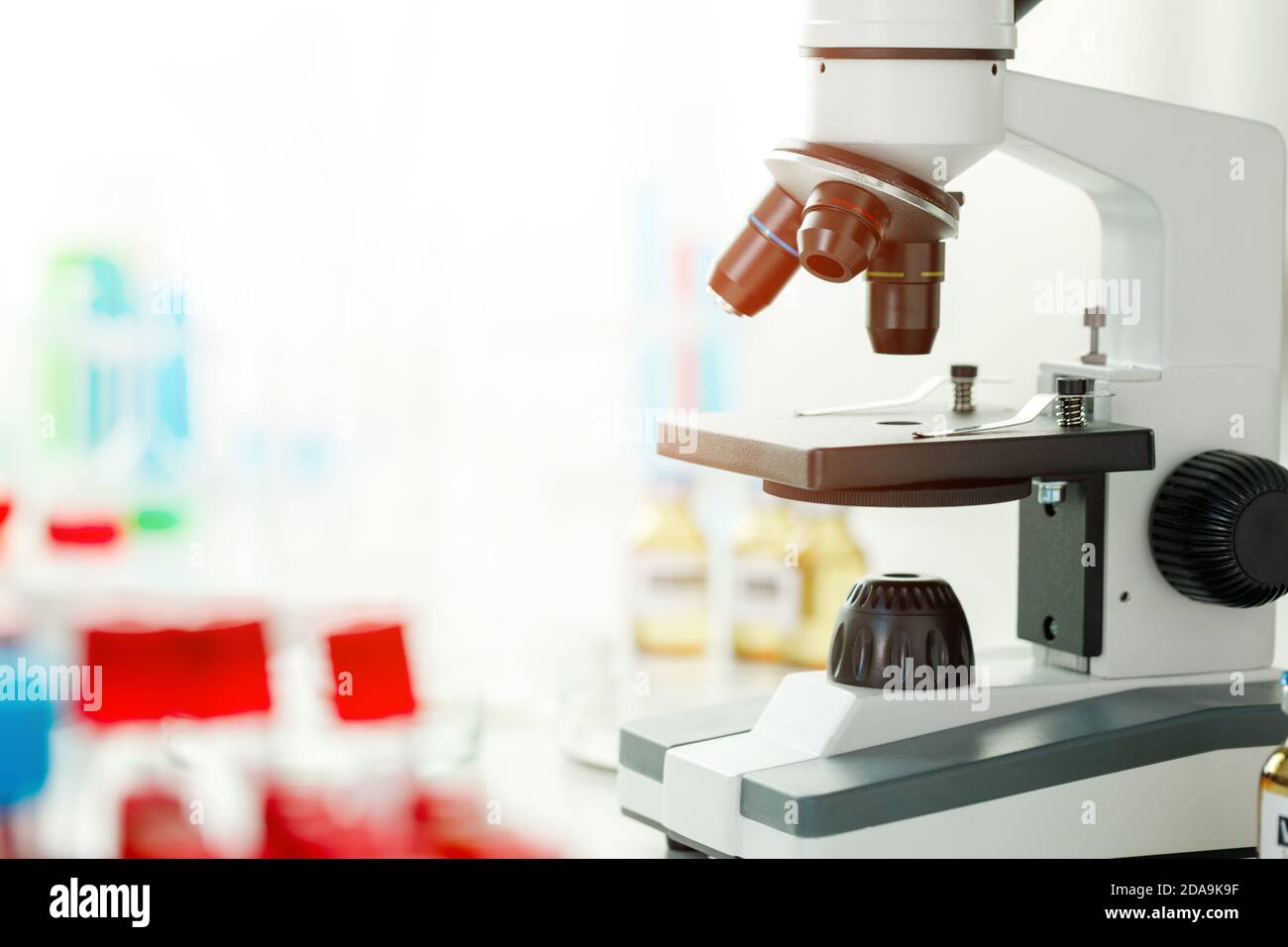 Microscope on the table with glassware in laboratory Stock Photo - Alamy