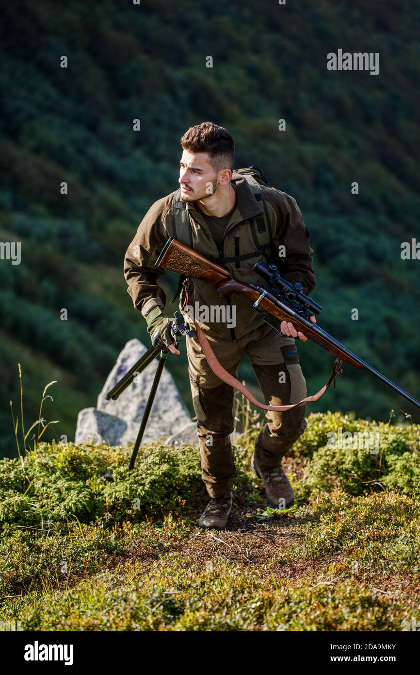 The man is on the hunt. Hunt hunting rifle. Hunter man. Shooter ...