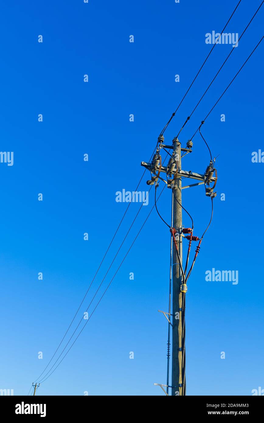 electric power sky lines and connections on a wooden post. wooden ...