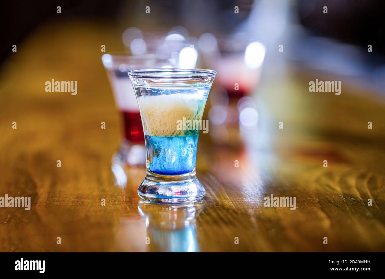 Alcoholic drinks in shot glasses. Tequila shots, vodka, whisky. Set of ...