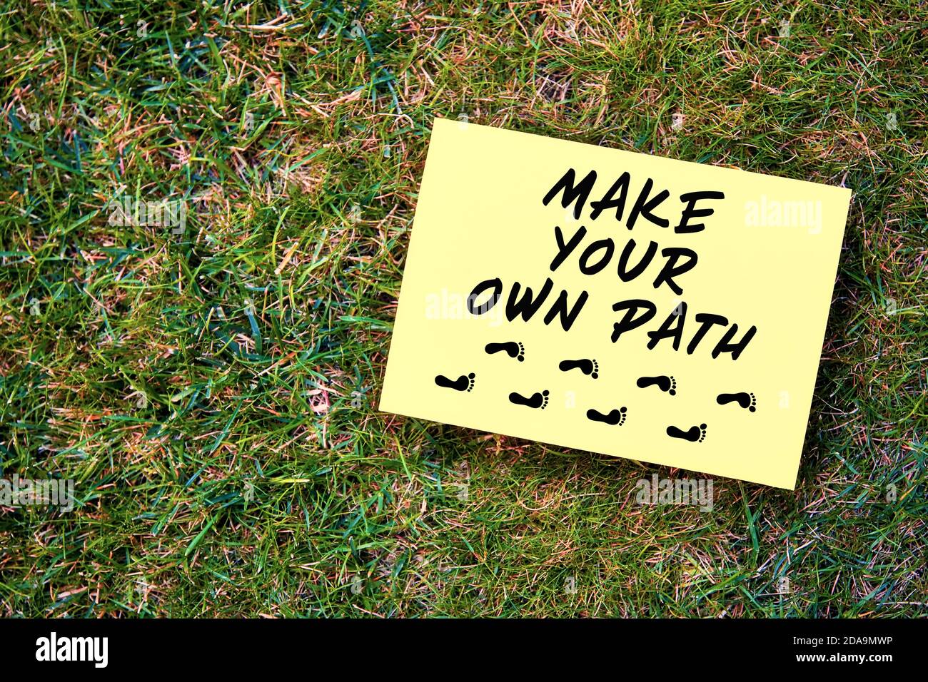 Make your own path message written on yellow paper on green grass ...