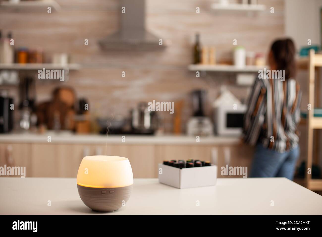 Essential oils diffuser distributing aromatherapy. Aroma health essence ...