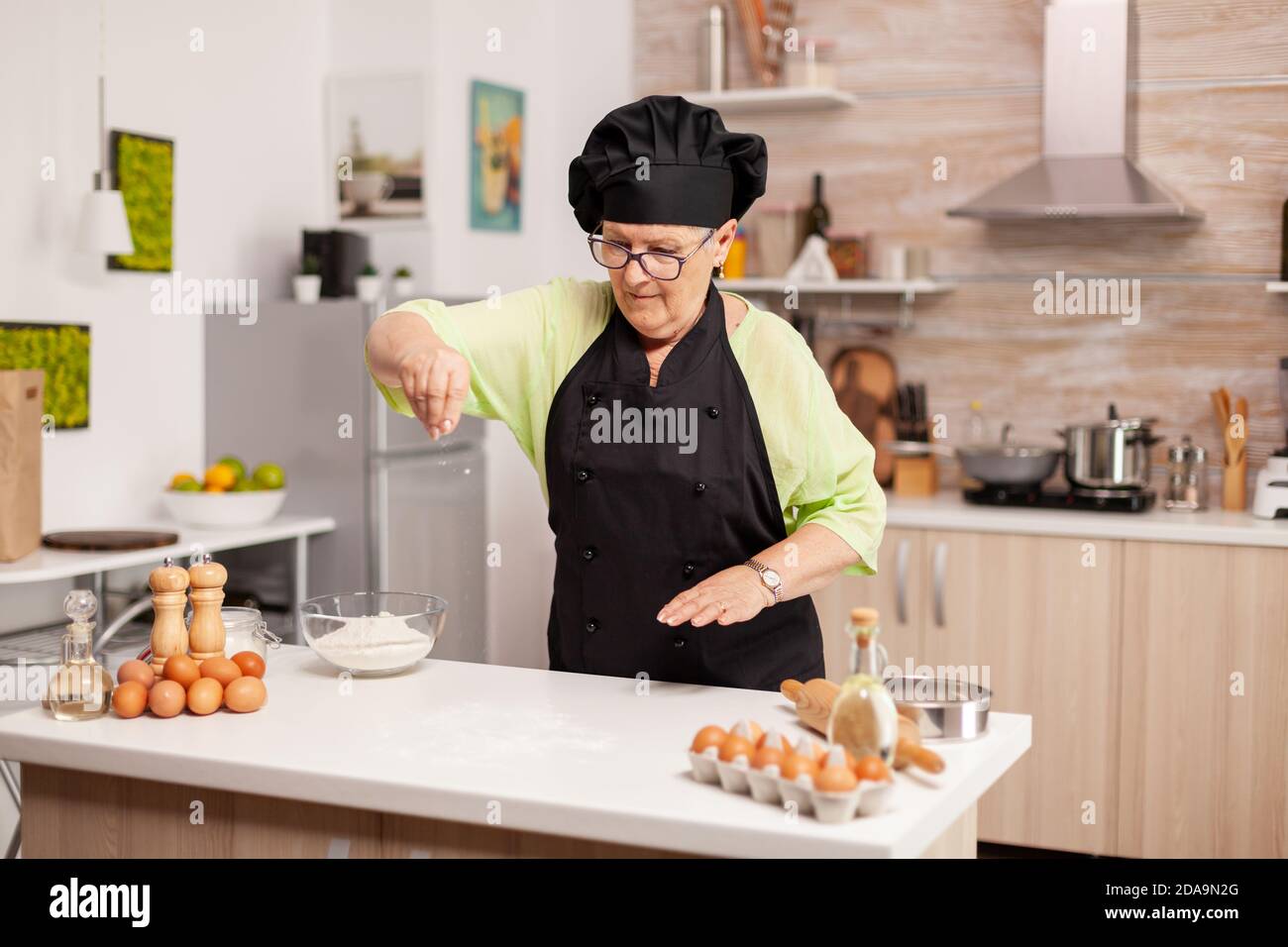 Elderly chef uniform sprinkling hi-res stock photography and images - Alamy
