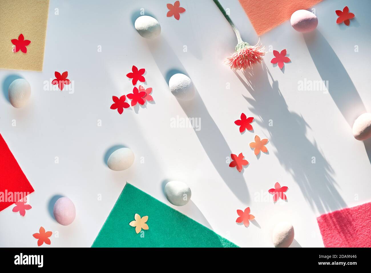 Easter background with eggs, floral confetti and felt for craft ...