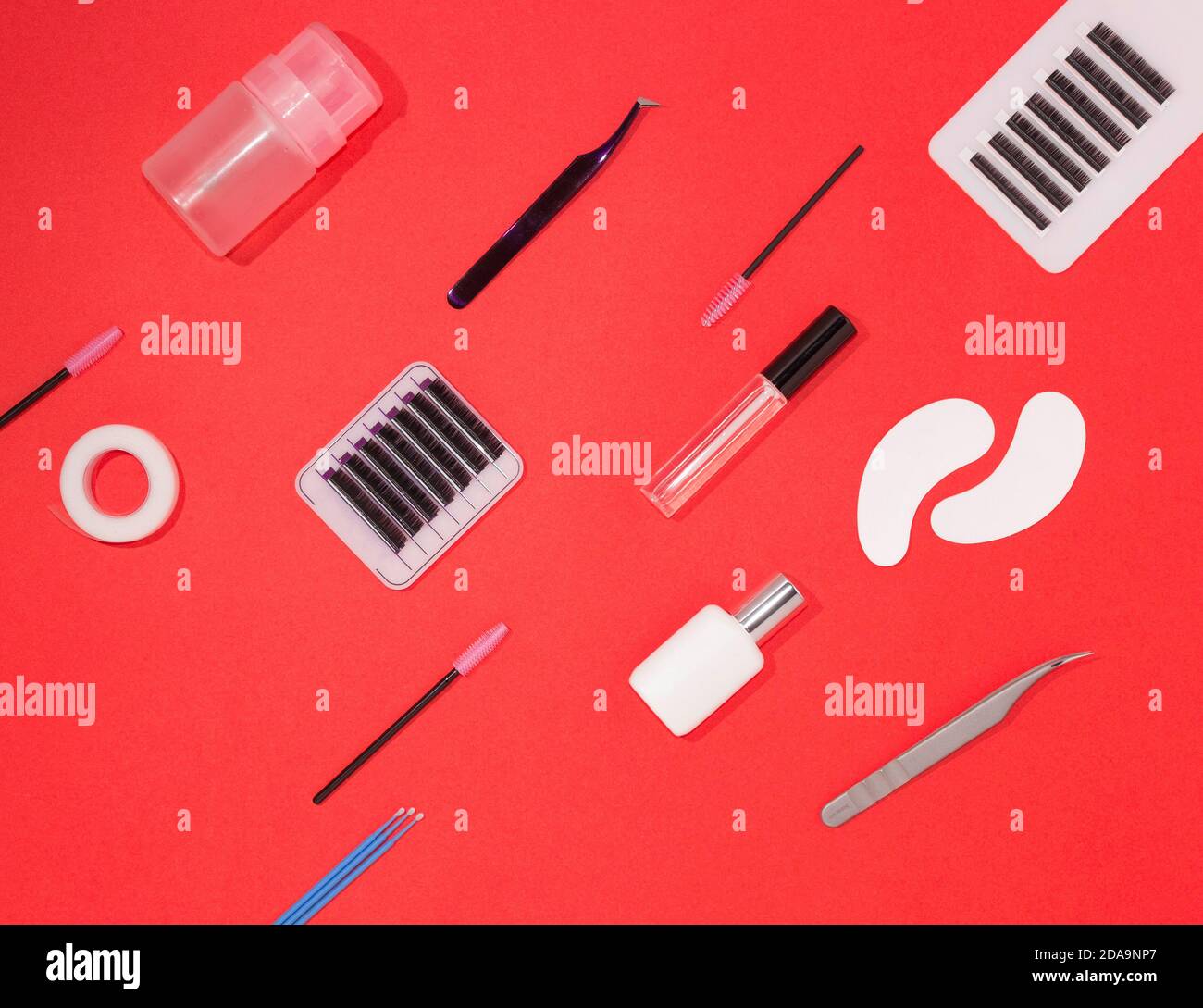 Tools for eyelash extension on an orange background, top view ...