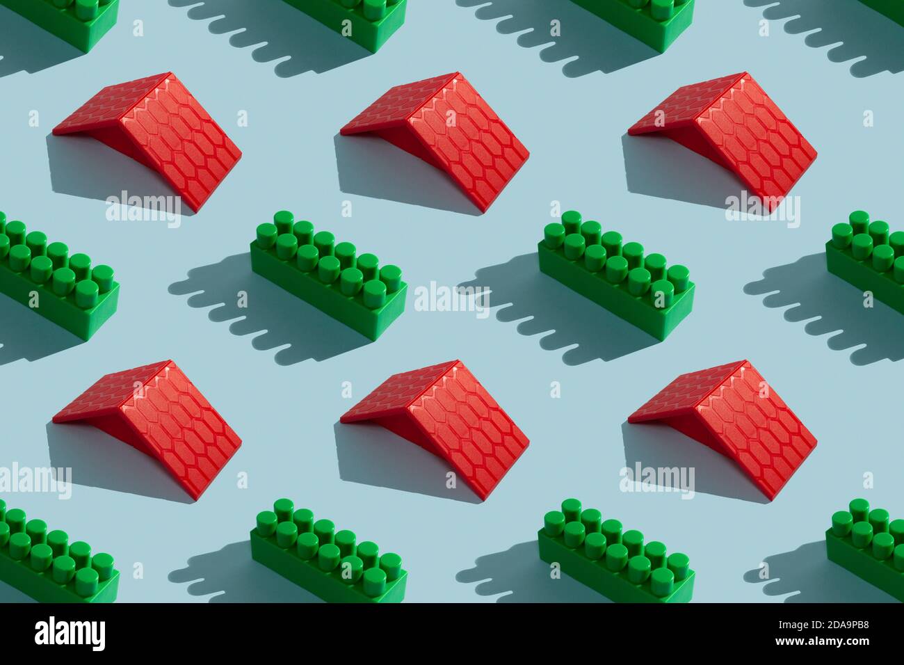 Red and green construction blocks on a blue background, seamless ...