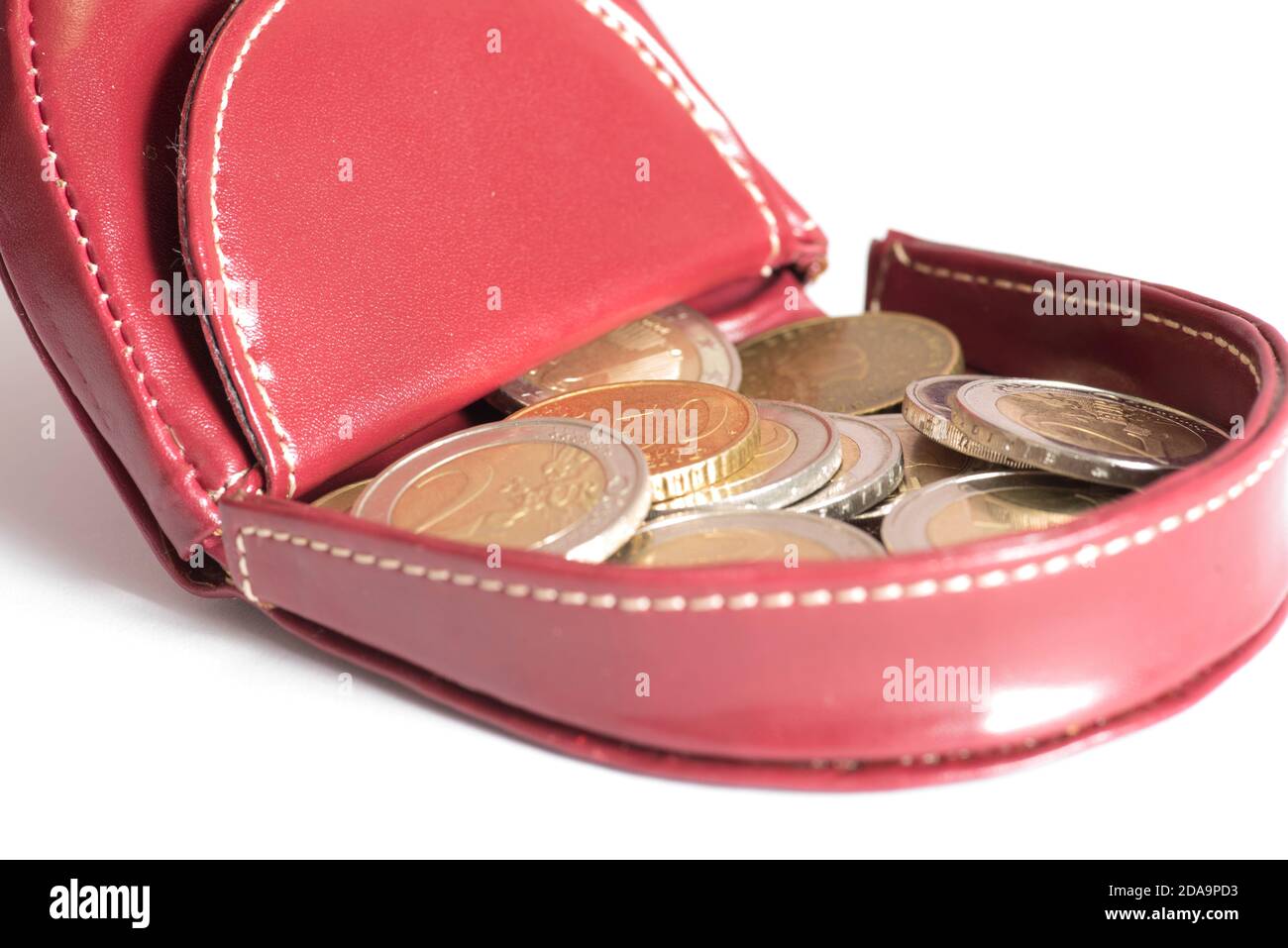 A wallet and lots of euro coins Stock Photo - Alamy